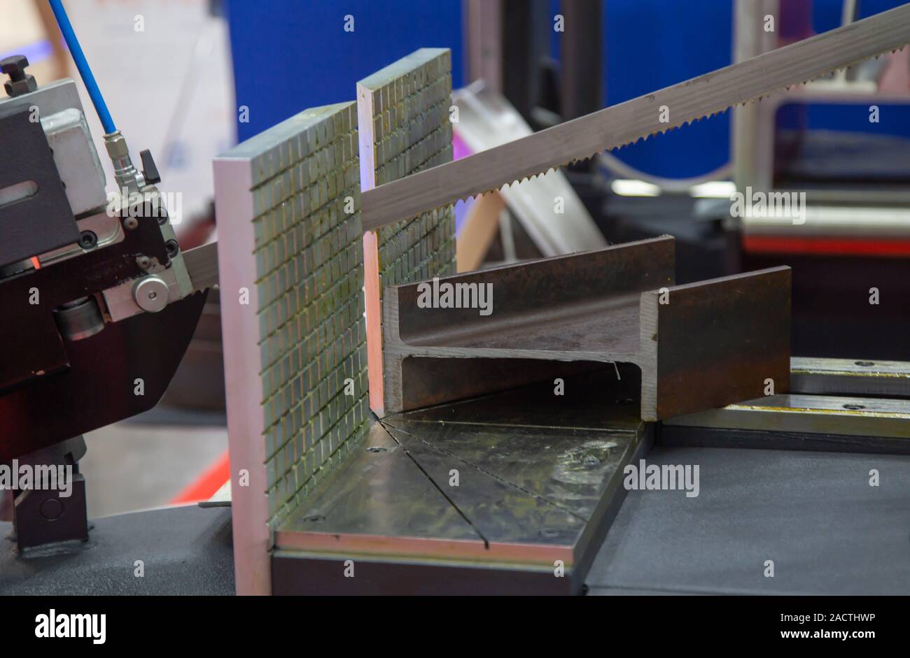 Band saw machine cutting metal I-Beam in workshop Stock Photo - Alamy