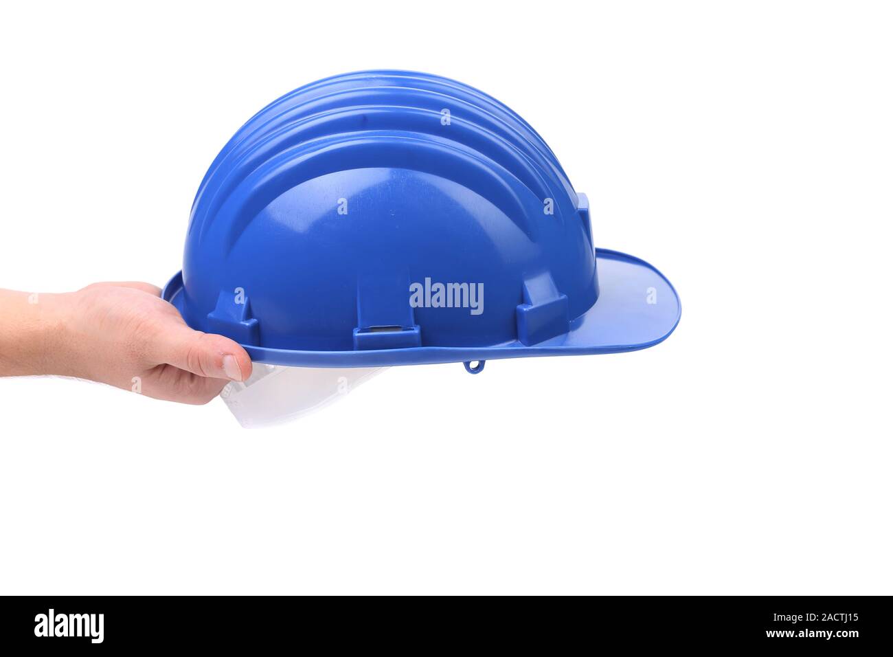 Hand holding blue hard hat Stock Photo - Alamy