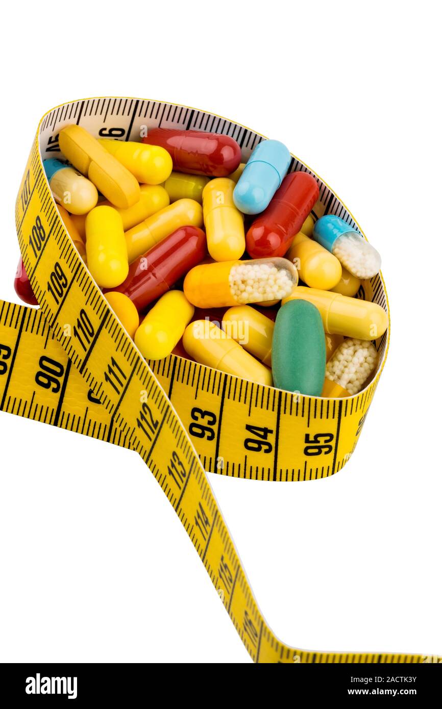 Tablets and measuring tape Stock Photo - Alamy