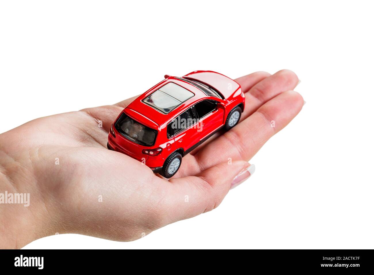 Hand holds model of a car Stock Photo - Alamy