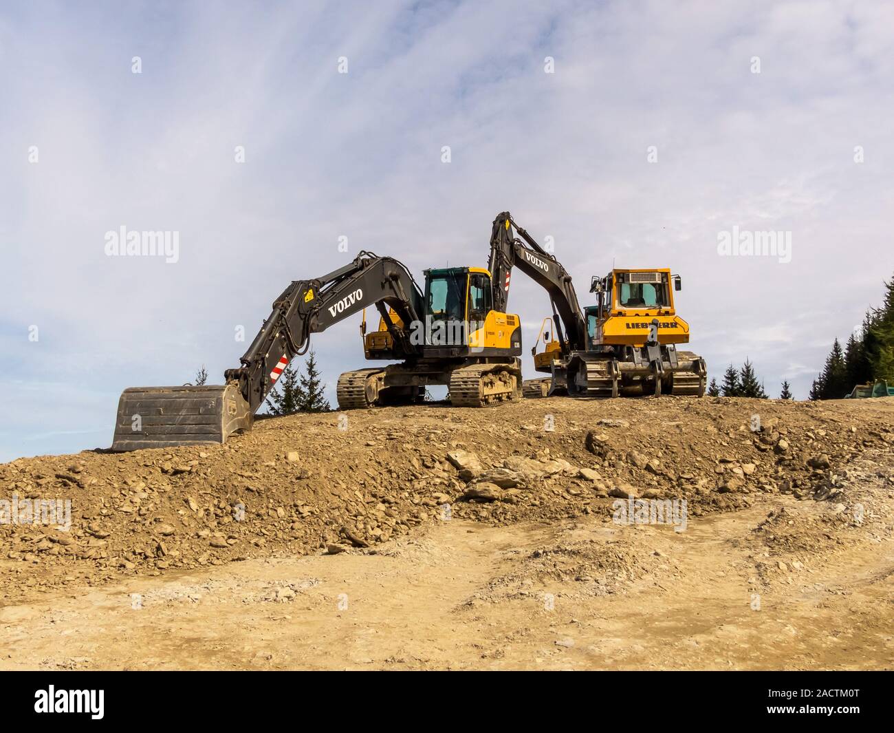 Excavator on a road construction site Stock Photo - Alamy