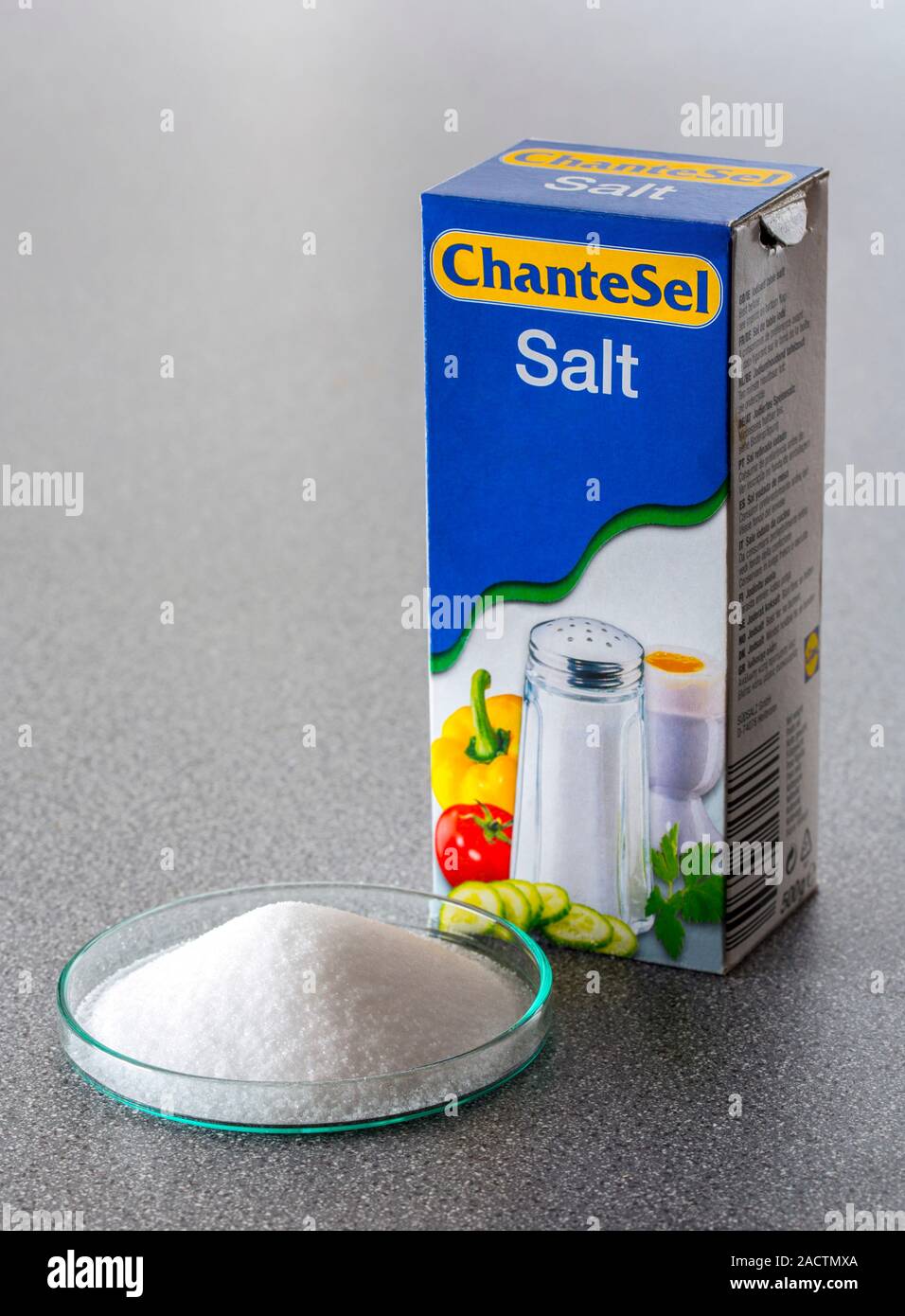 Salt packet and a mole of sodium chloride. Contained in the petri dish ...