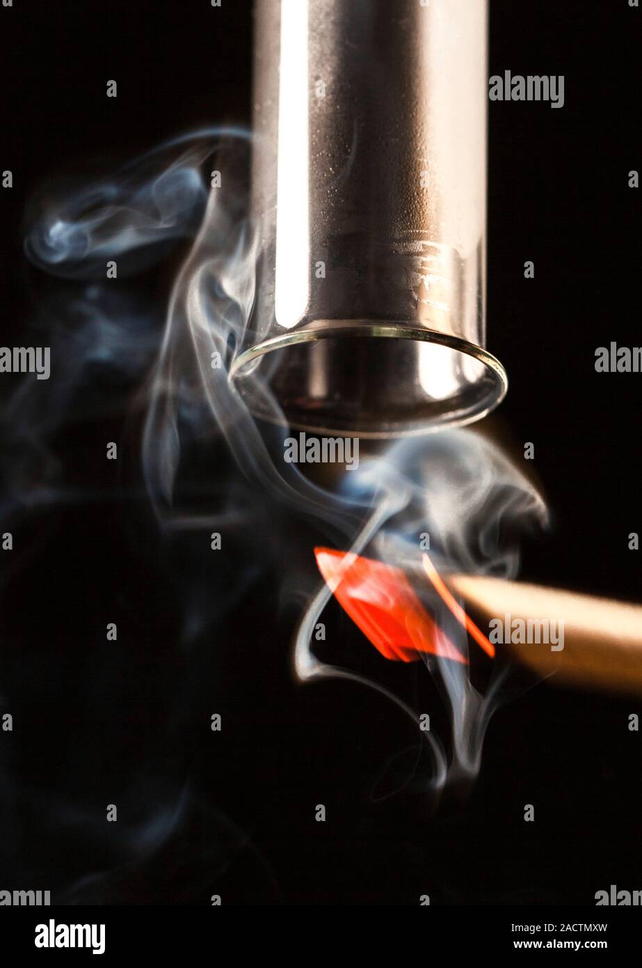 Lit splint test for hydrogen gas. Lit splint after being placed at the ...