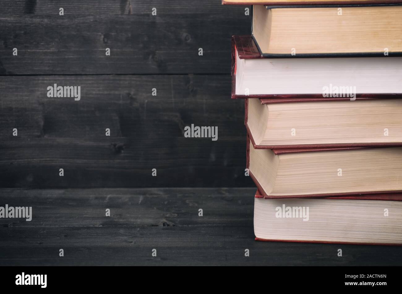 Old Law books on the black wooden background, black wooden backdrop ...