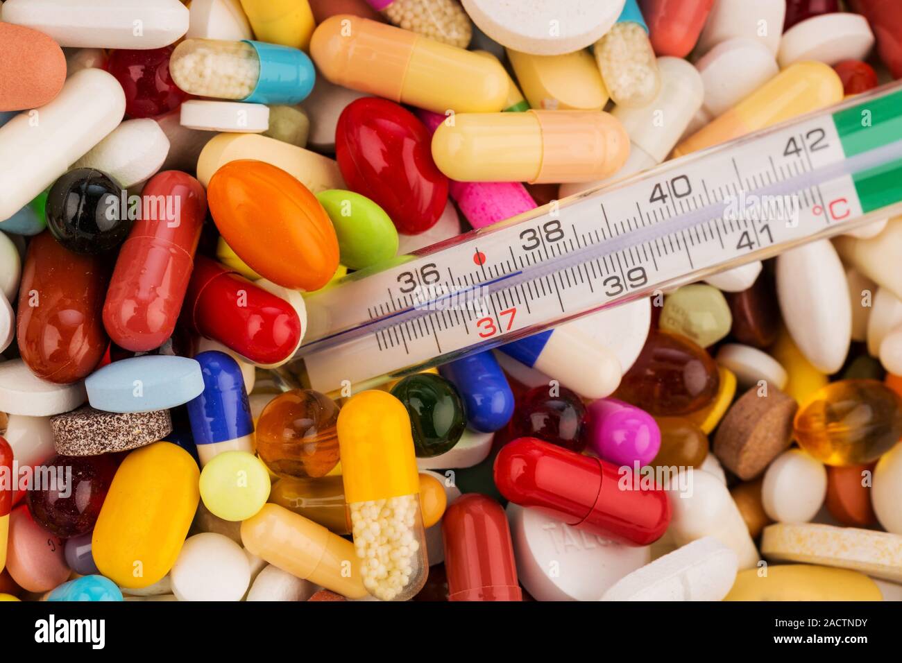 Fever thermometers and tablets Stock Photo - Alamy