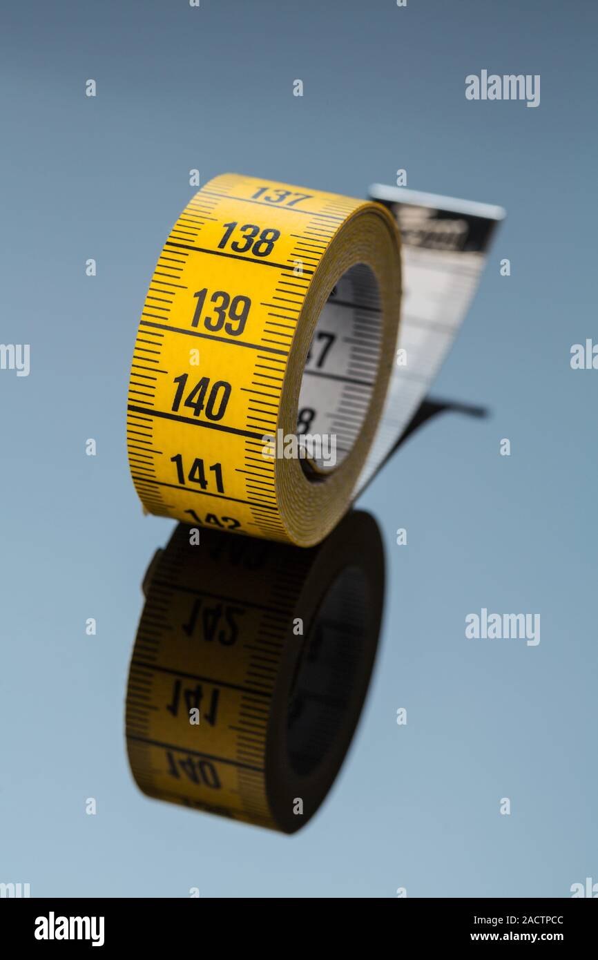Yellow tape measure Stock Photo - Alamy