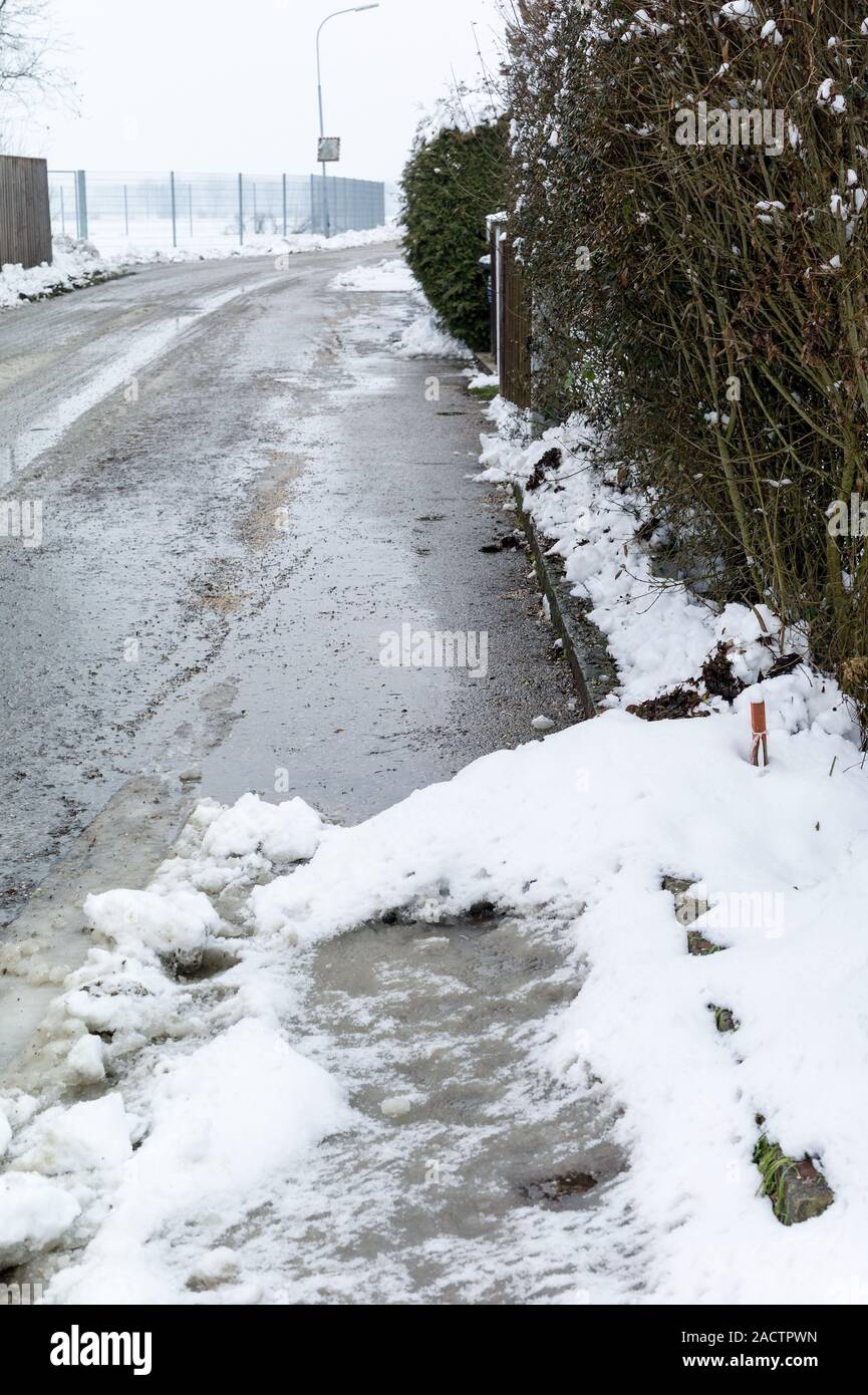 Snow on sidewalk Stock Photo - Alamy