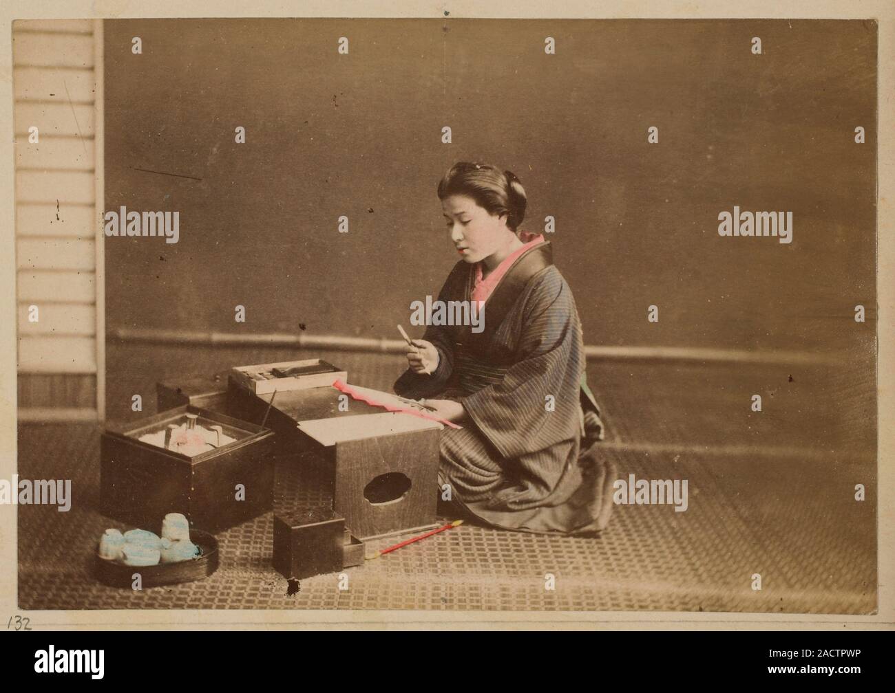 Photograph of woman making fans Stock Photo - Alamy