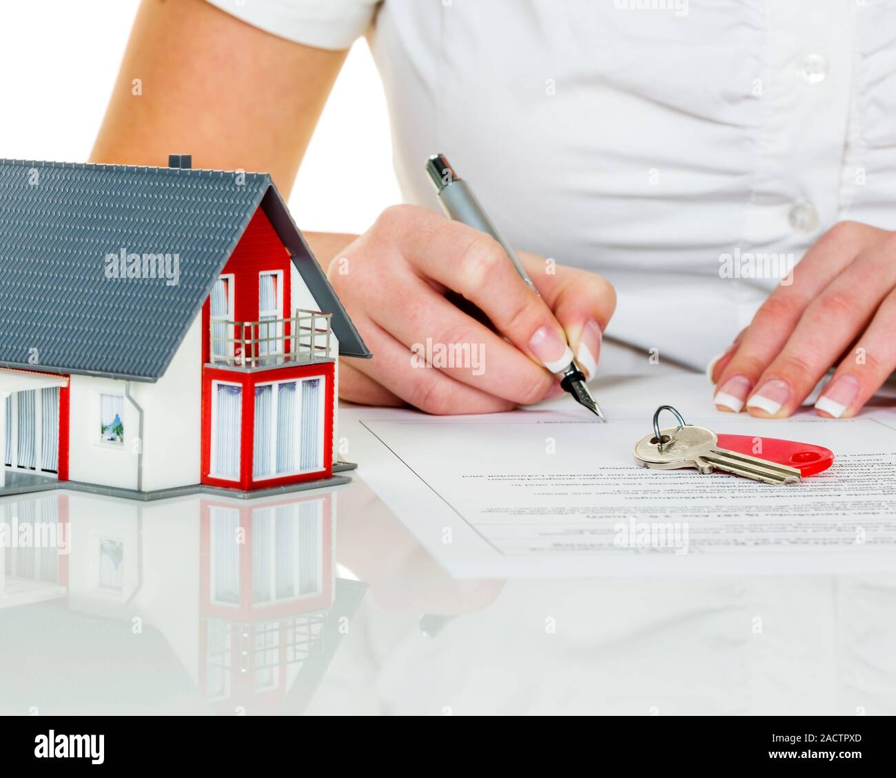 Woman signs purchase contract for house Stock Photo - Alamy