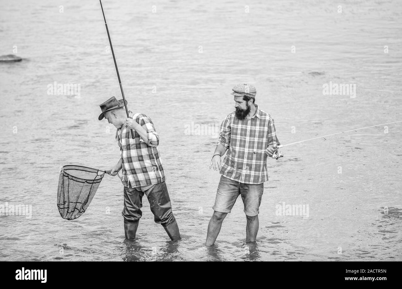Men friends fishing together Black and White Stock Photos & Images - Alamy