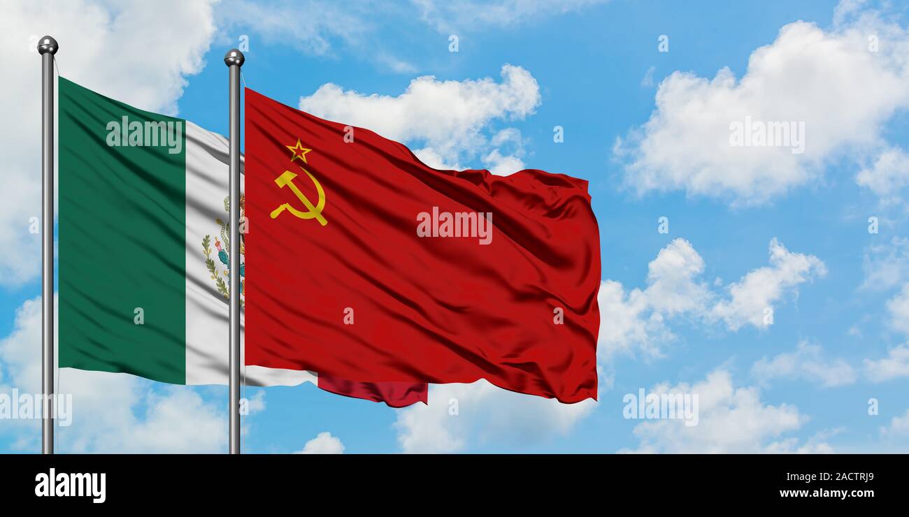 Mexico and Soviet Union flag waving in the wind against white cloudy ...