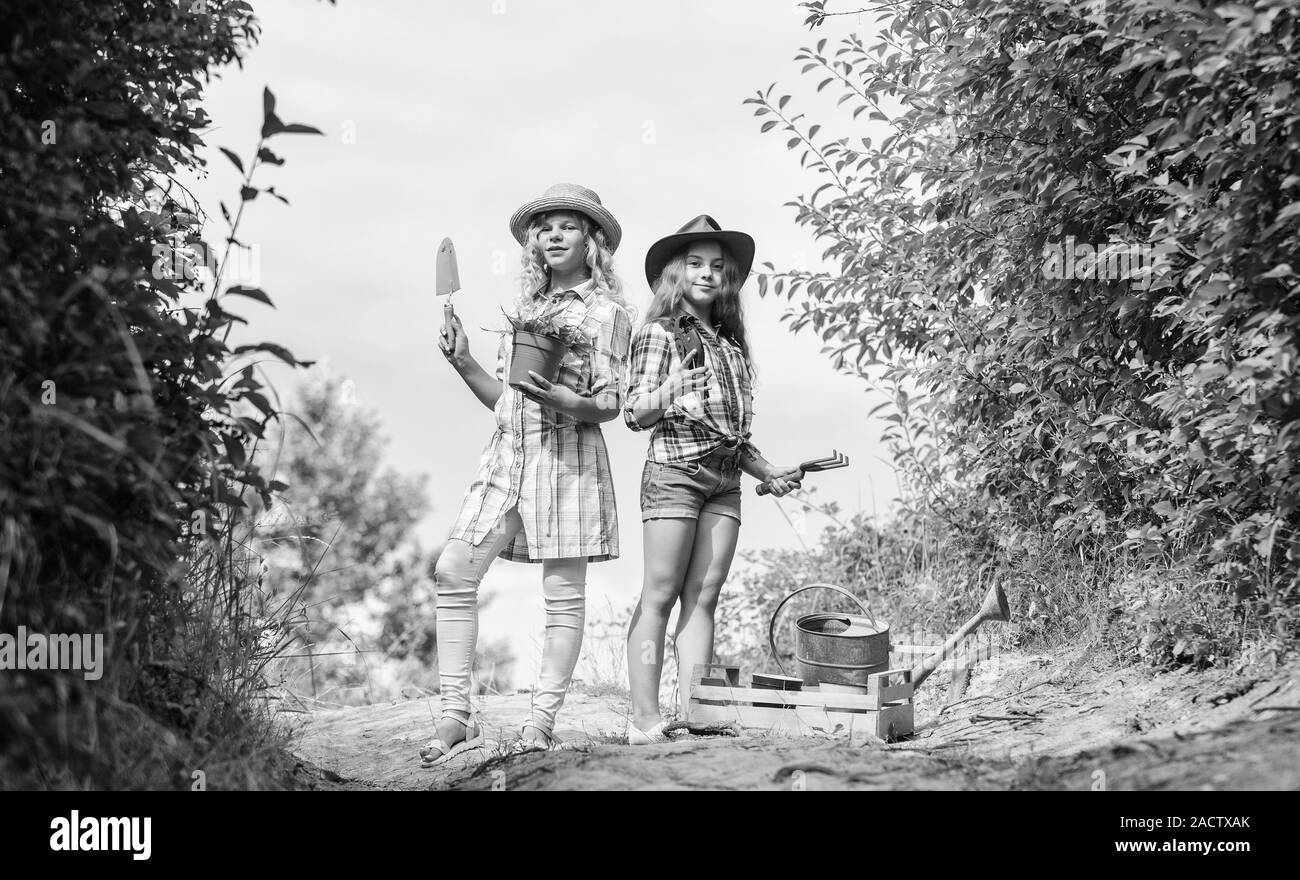 Flowers expert. children hold gardening tools. farming and agriculture ...