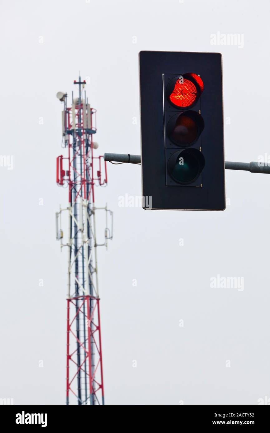 Mobile radio transmitter mast and red traffic light Stock Photo - Alamy