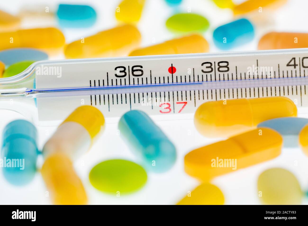 Fever thermometers and tablets Stock Photo - Alamy
