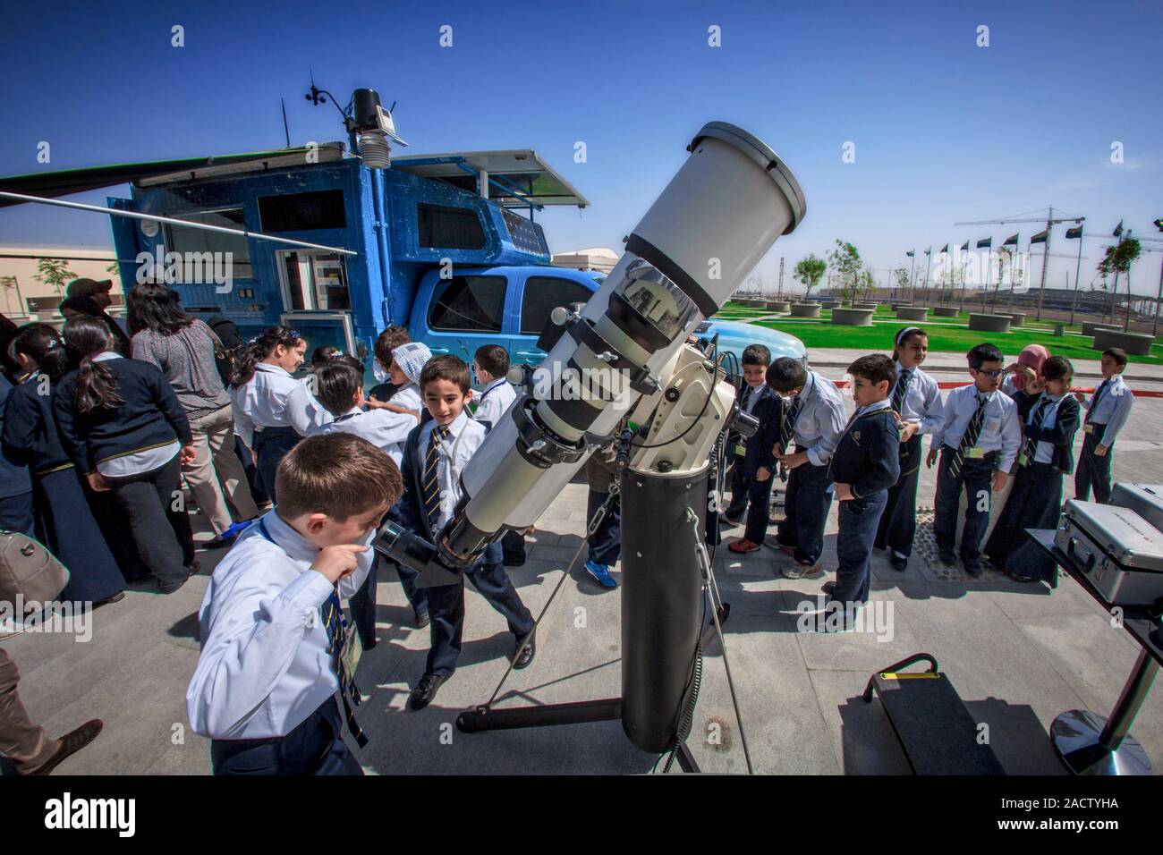 School sun observation program. School children at a public sun ...