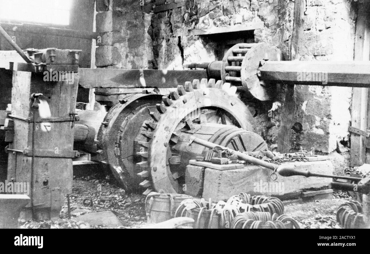 Ironworking forge machinery. The machinery shown here is a tilt hammer ...