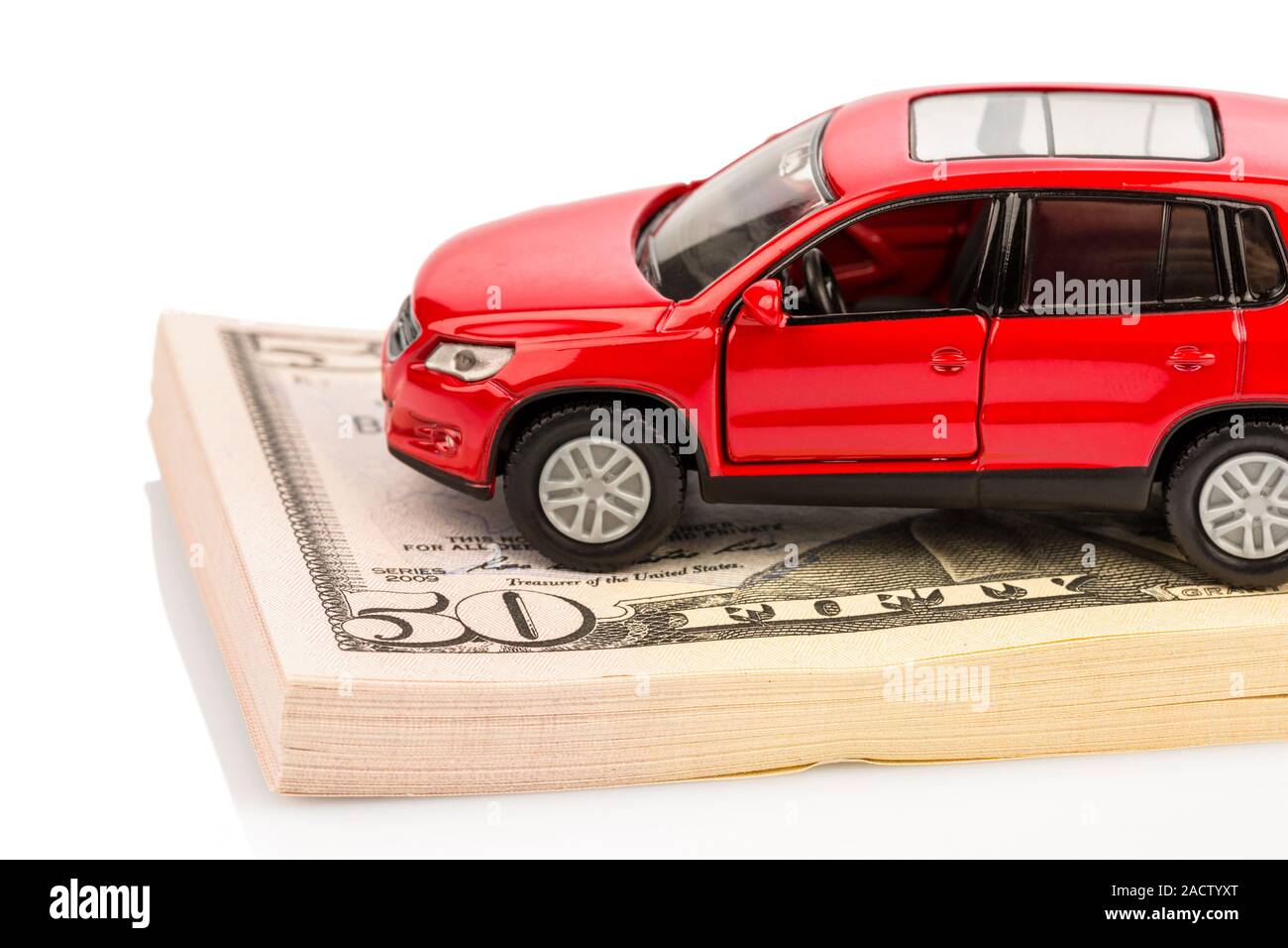Car on dollar banknotes Stock Photo - Alamy