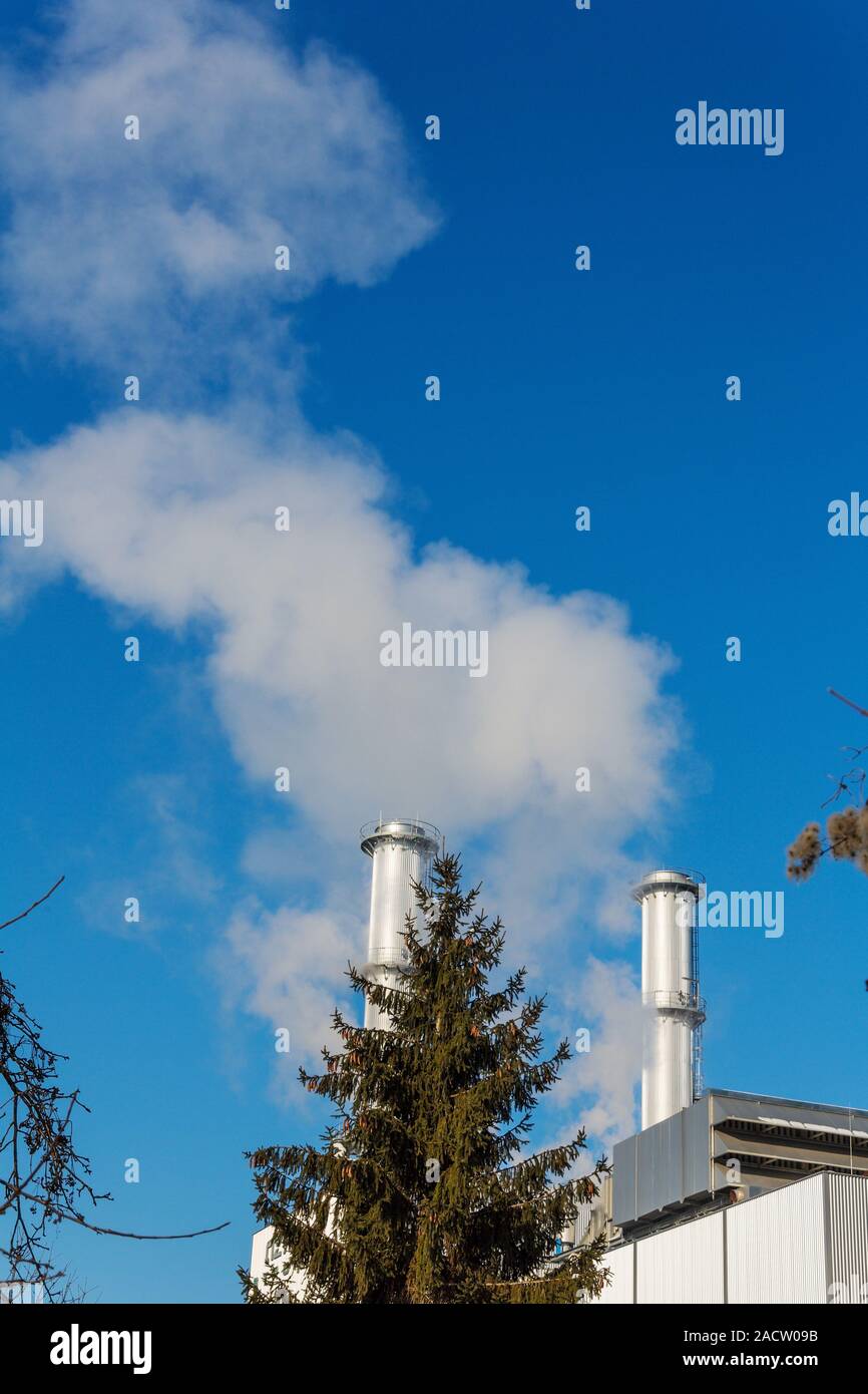 Industrial chimney with tree Stock Photo - Alamy