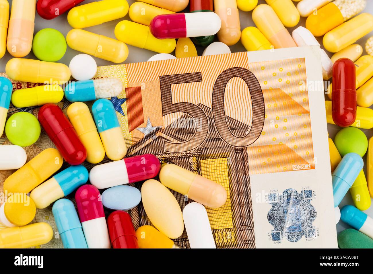 Euro banknotes and tablets Stock Photo - Alamy