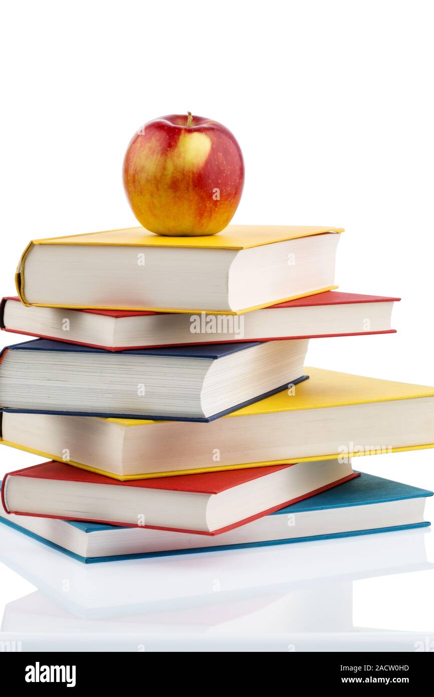 Apple on a stack of books Stock Photo - Alamy