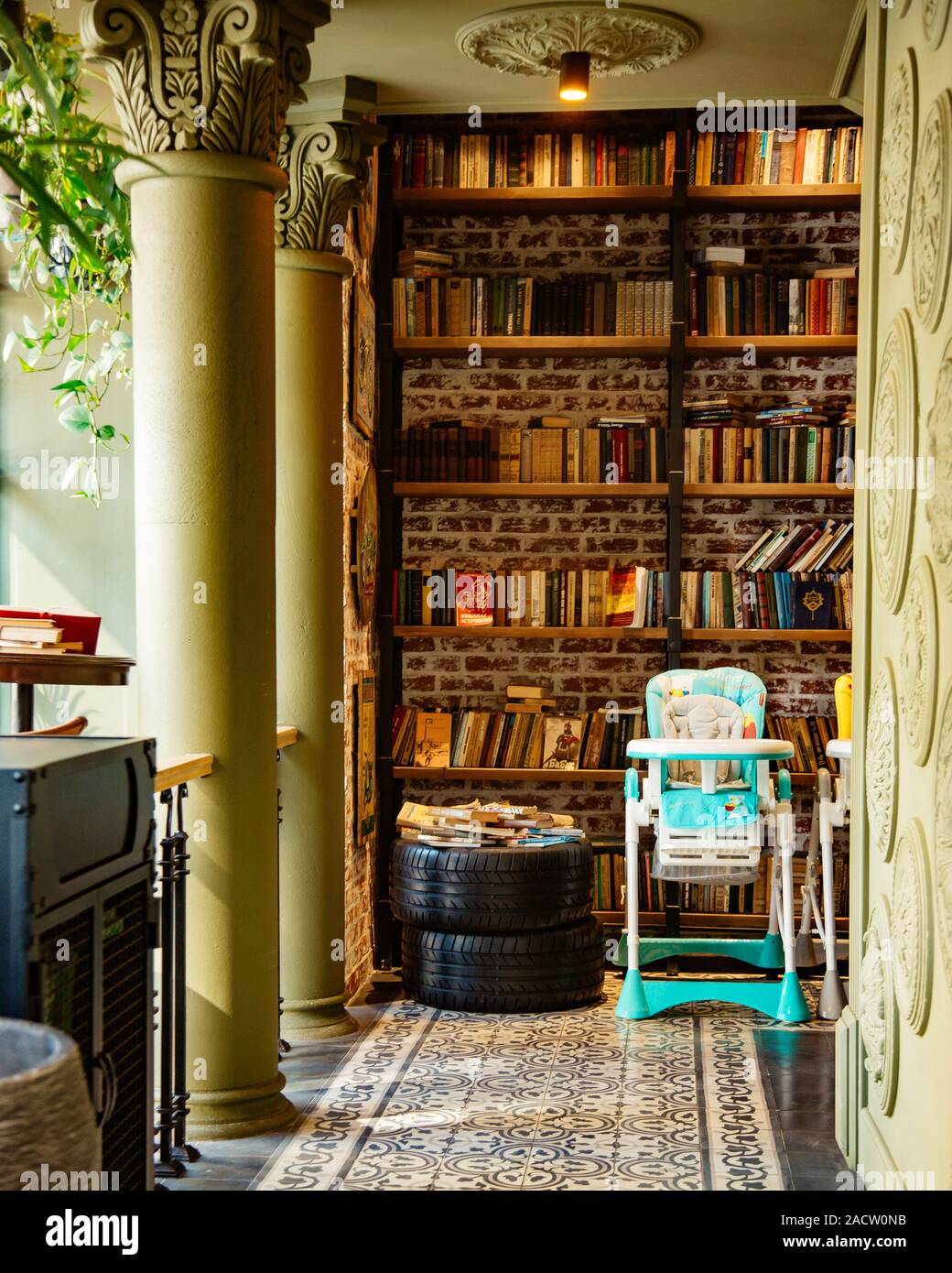 high shelf for books in a restaurant Stock Photo - Alamy