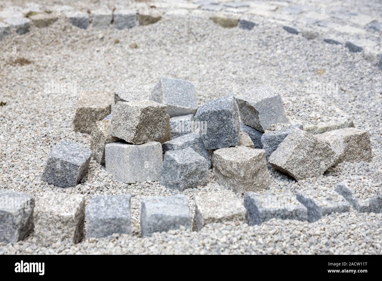 Laying granite stones Stock Photo - Alamy