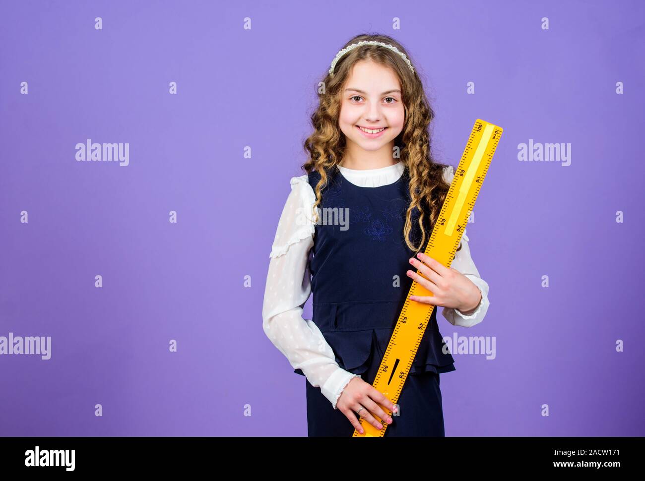 small girl back to school. Pupil girl with big ruler. STEM school ...