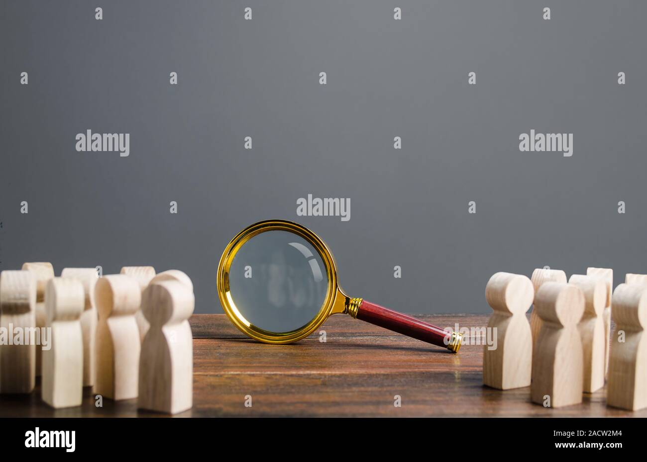 People looking at big magnifying glass. Search and tracing concept ...