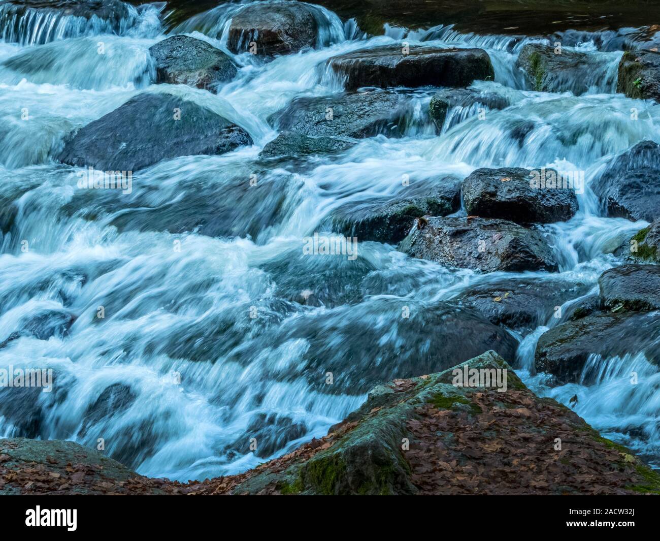 Stream with running water Stock Photo - Alamy