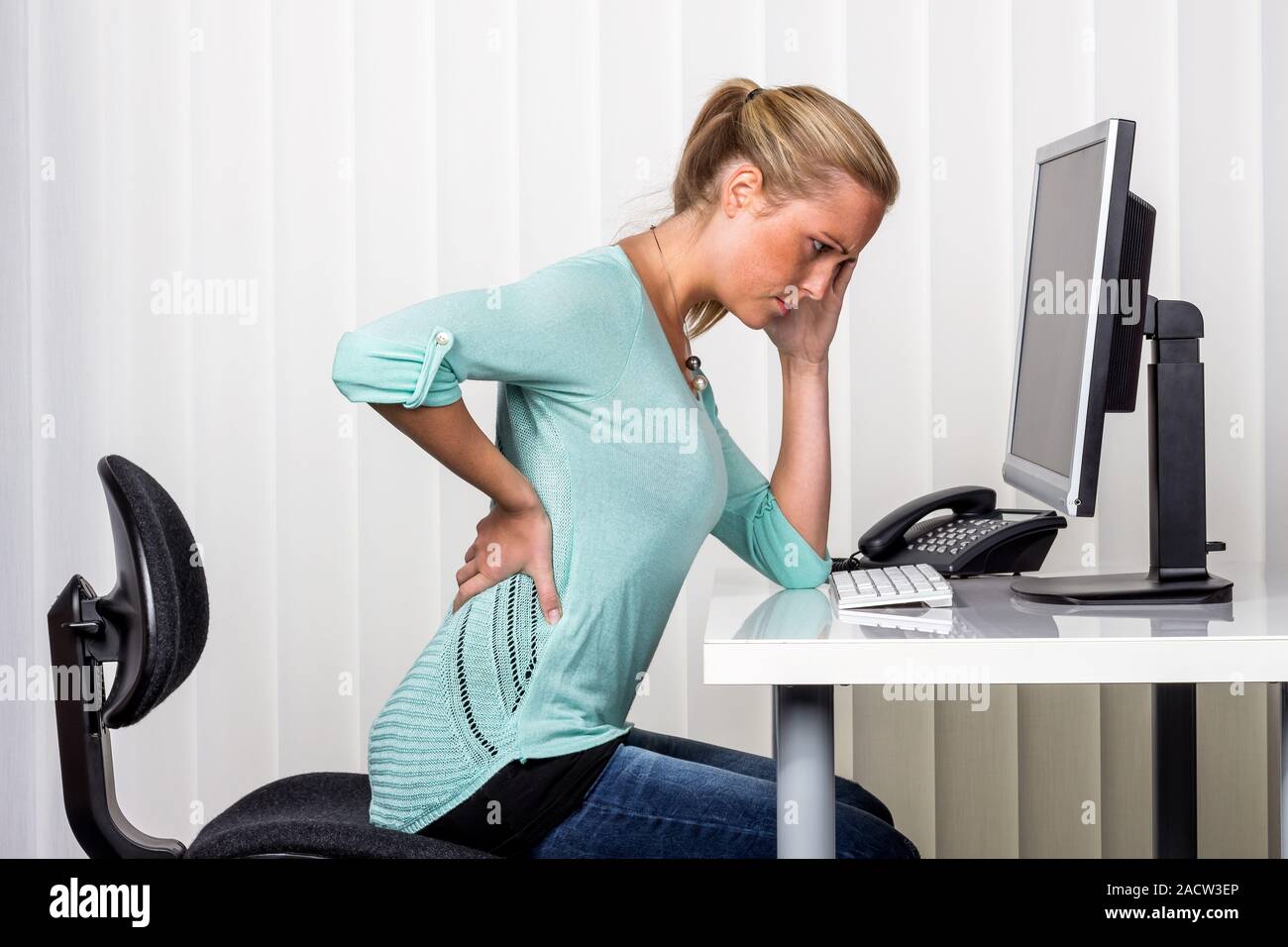 Woman back pain office hi-res stock photography and images - Alamy