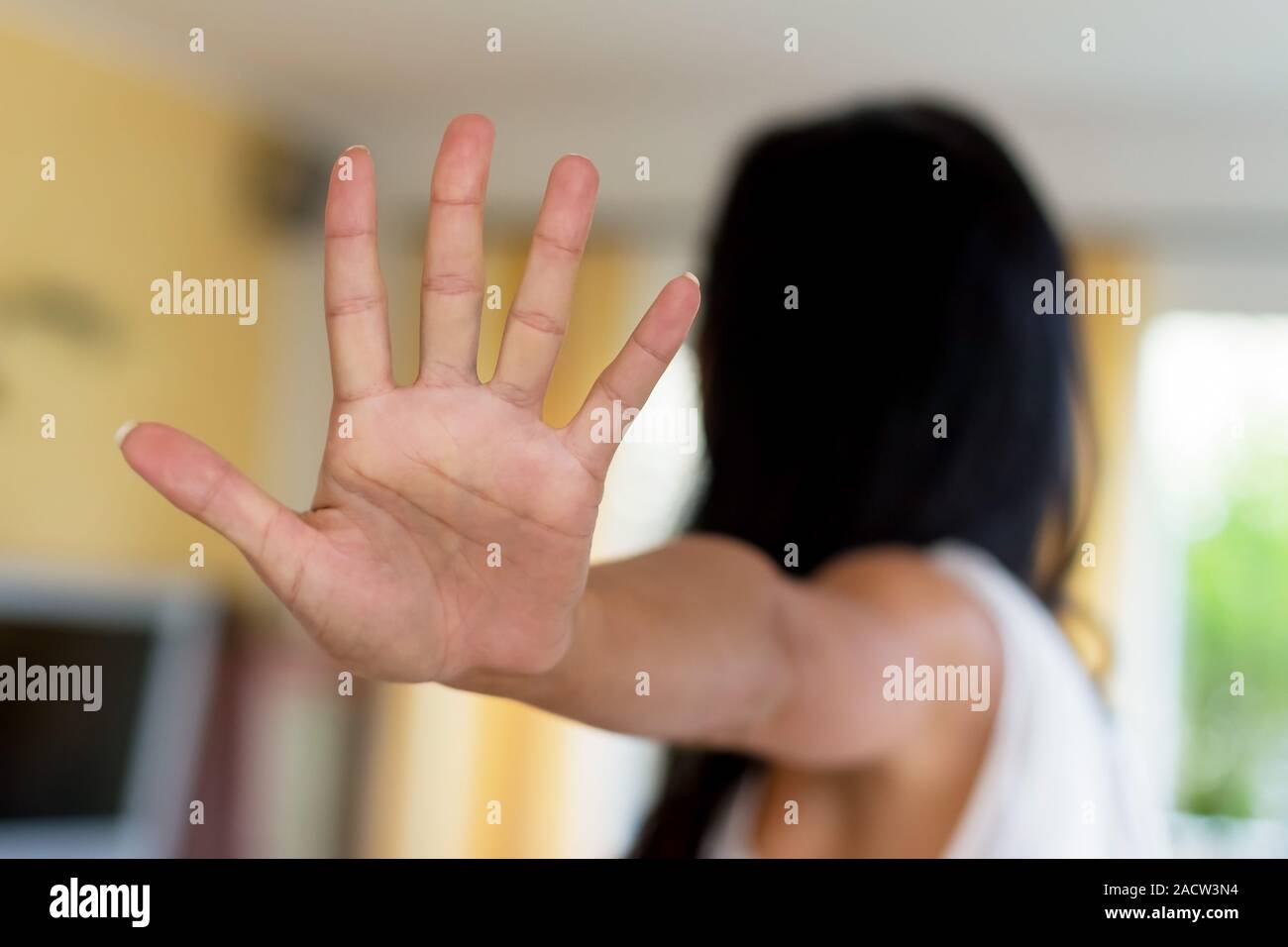 defensive attitude of a woman Stock Photo - Alamy