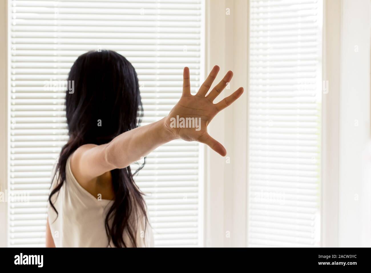 defensive attitude of a woman Stock Photo - Alamy