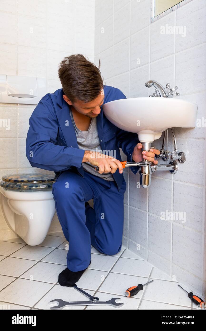 Plumber at work Stock Photo - Alamy