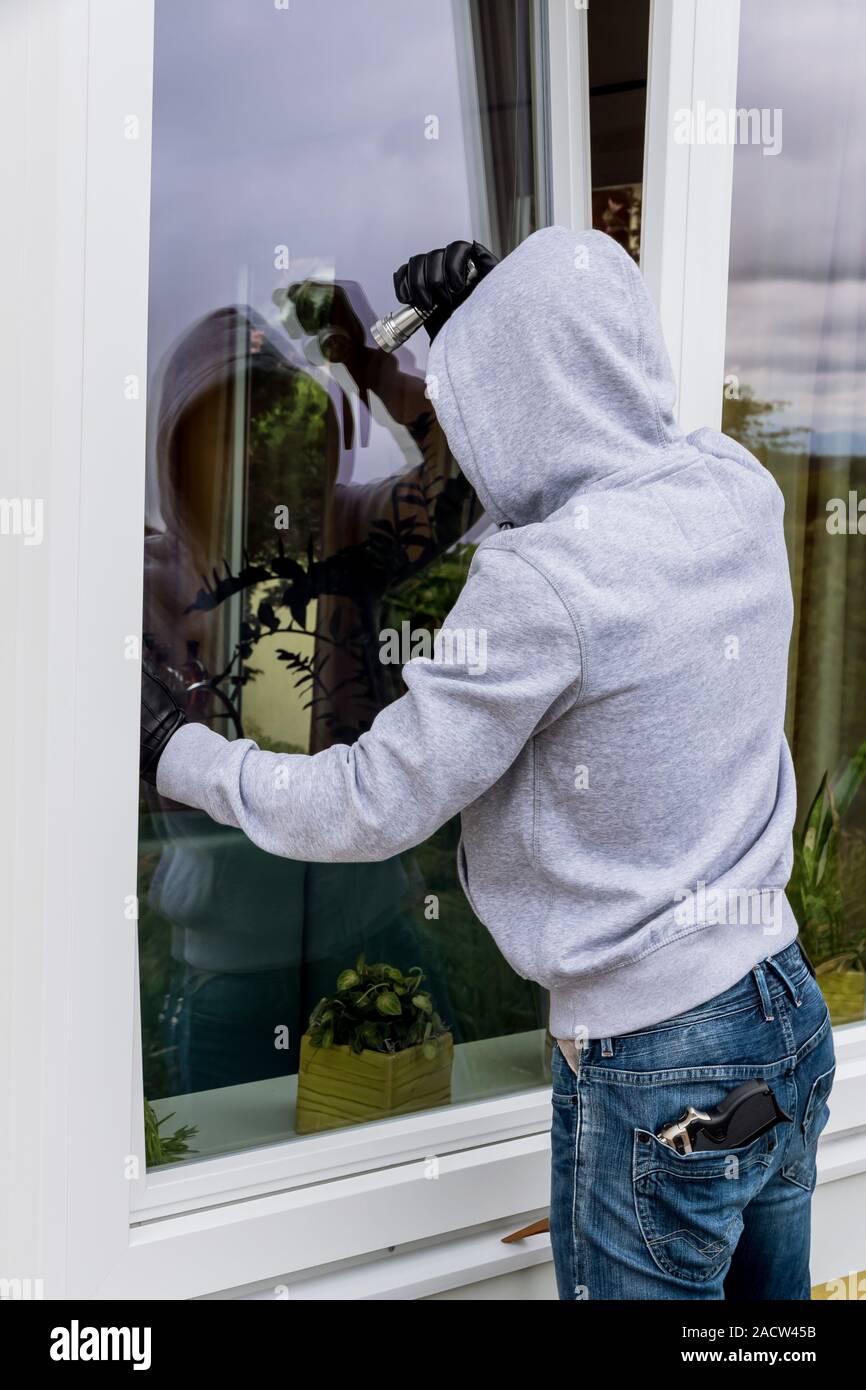 Burglar at a window Stock Photo - Alamy