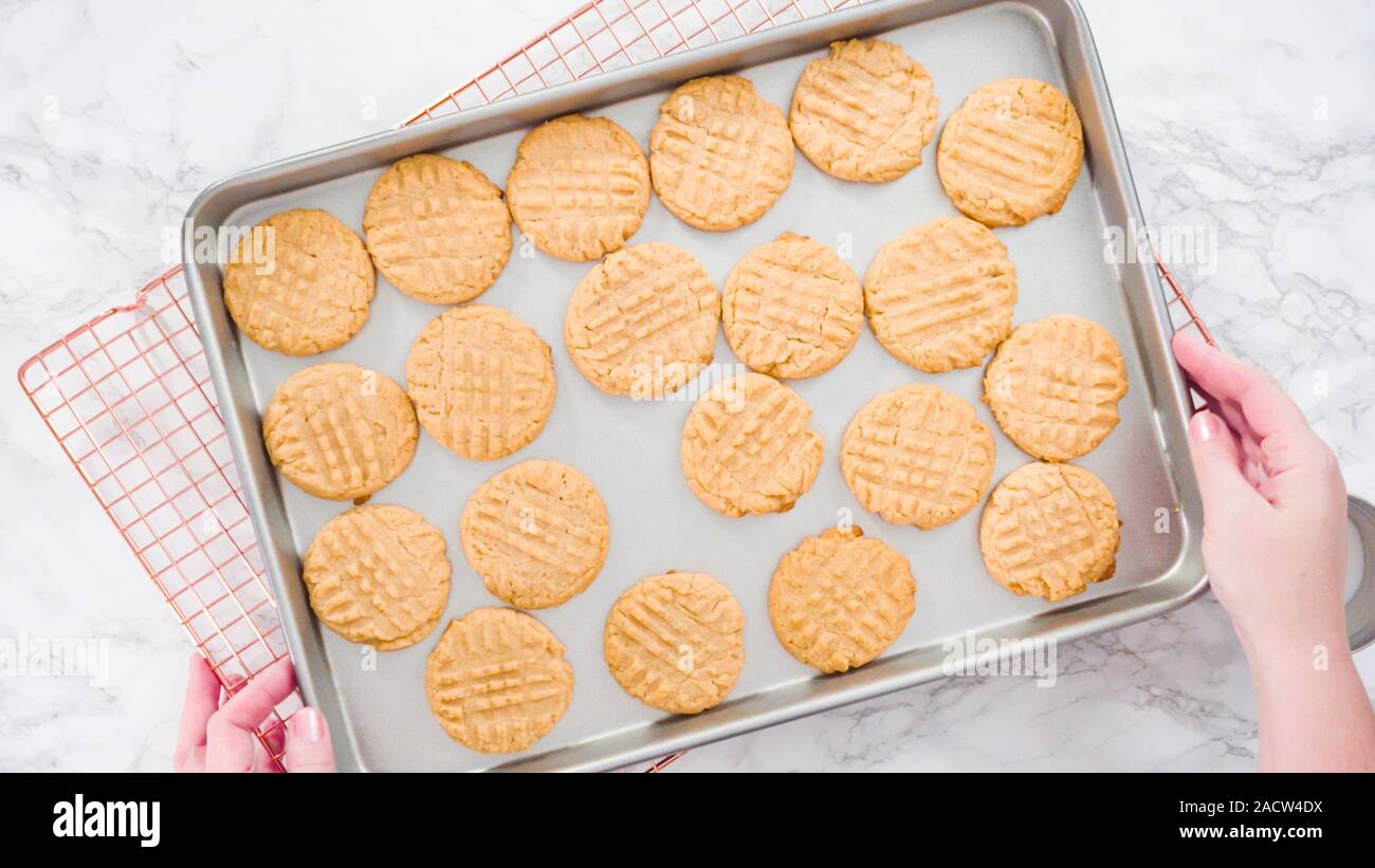 Flat lay. Step by step. Freshly baked peanut butter cookies on baking ...