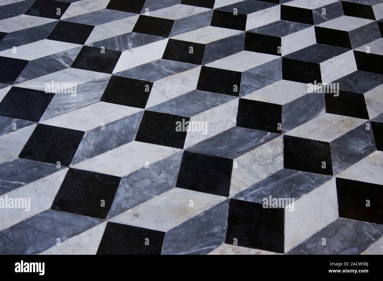 A patterned marble floor in an Italian church that produces a three ...
