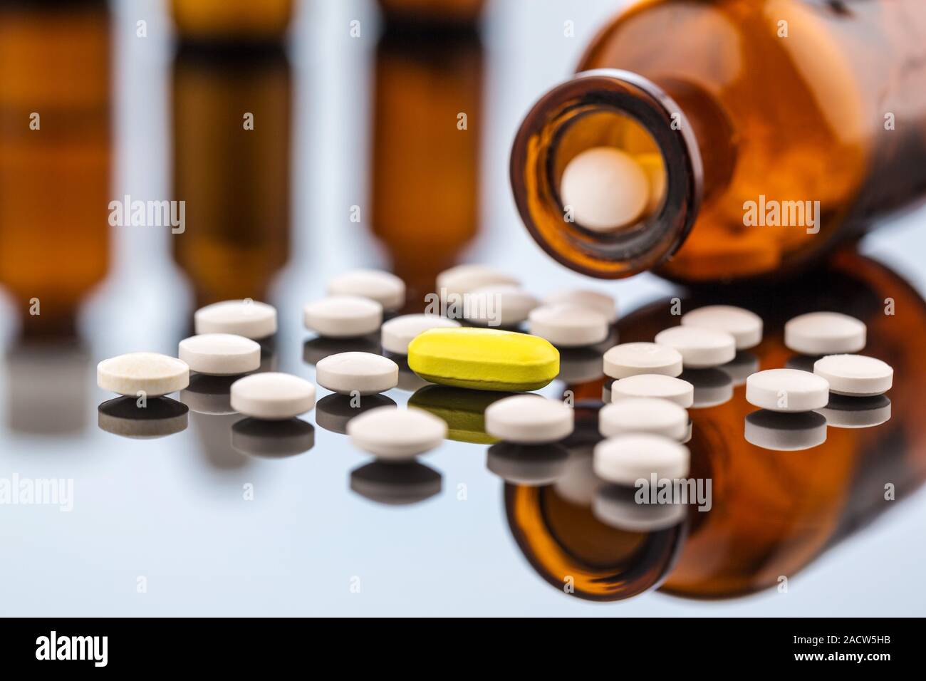 Many tablets with container Stock Photo - Alamy