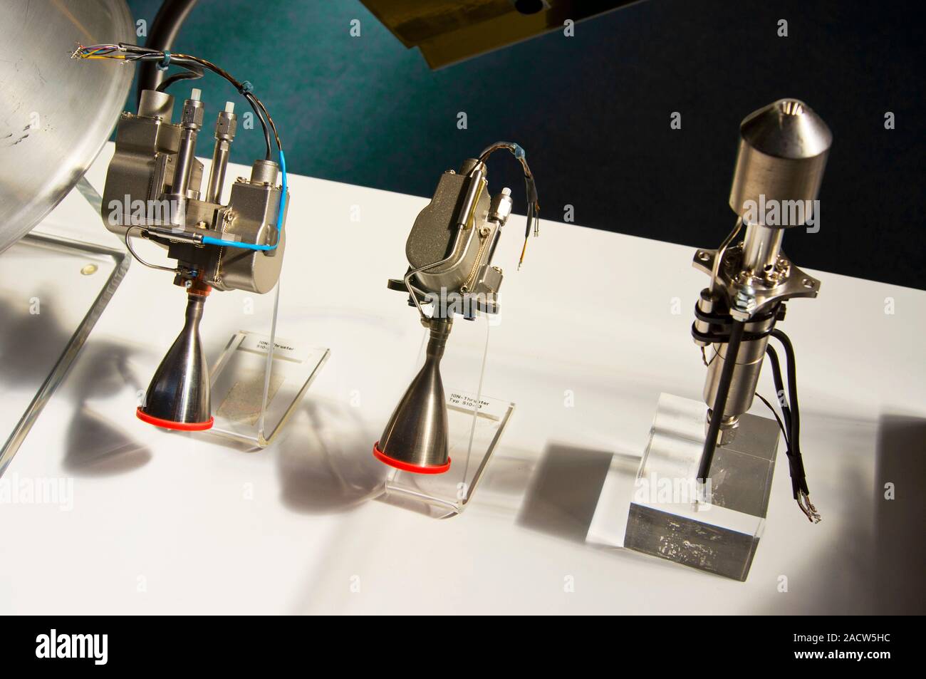 Three satellite thrusters on display at the 2012 International ...