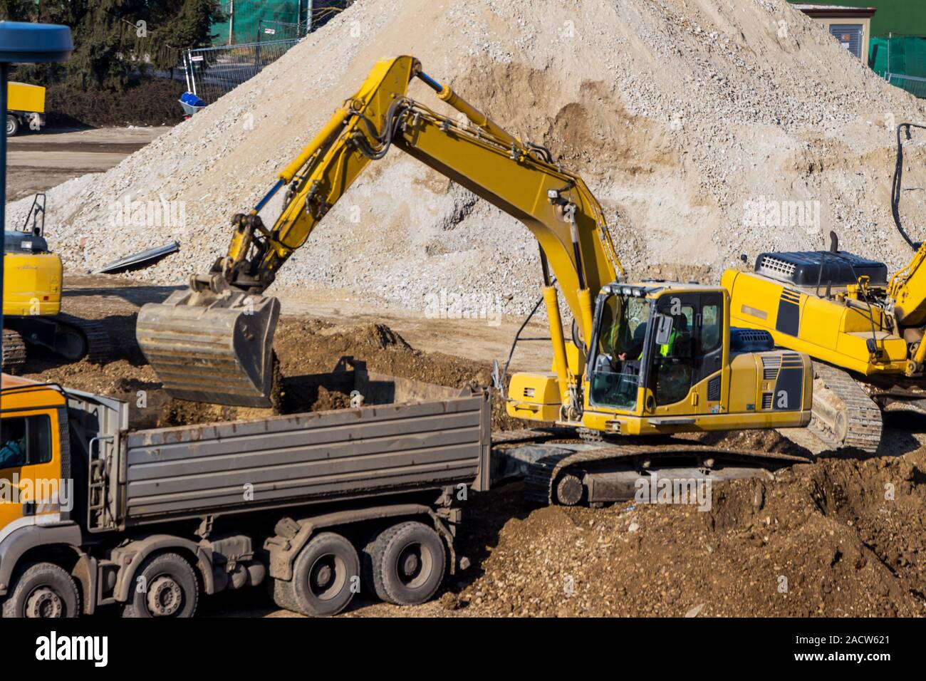 Excavator on construction site during earthworks Stock Photo - Alamy
