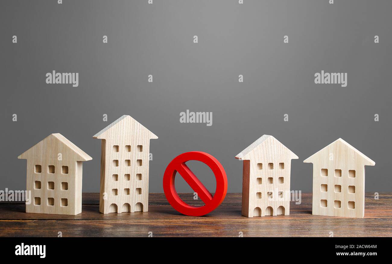 A red prohibition sign no stands among residential buildings ...