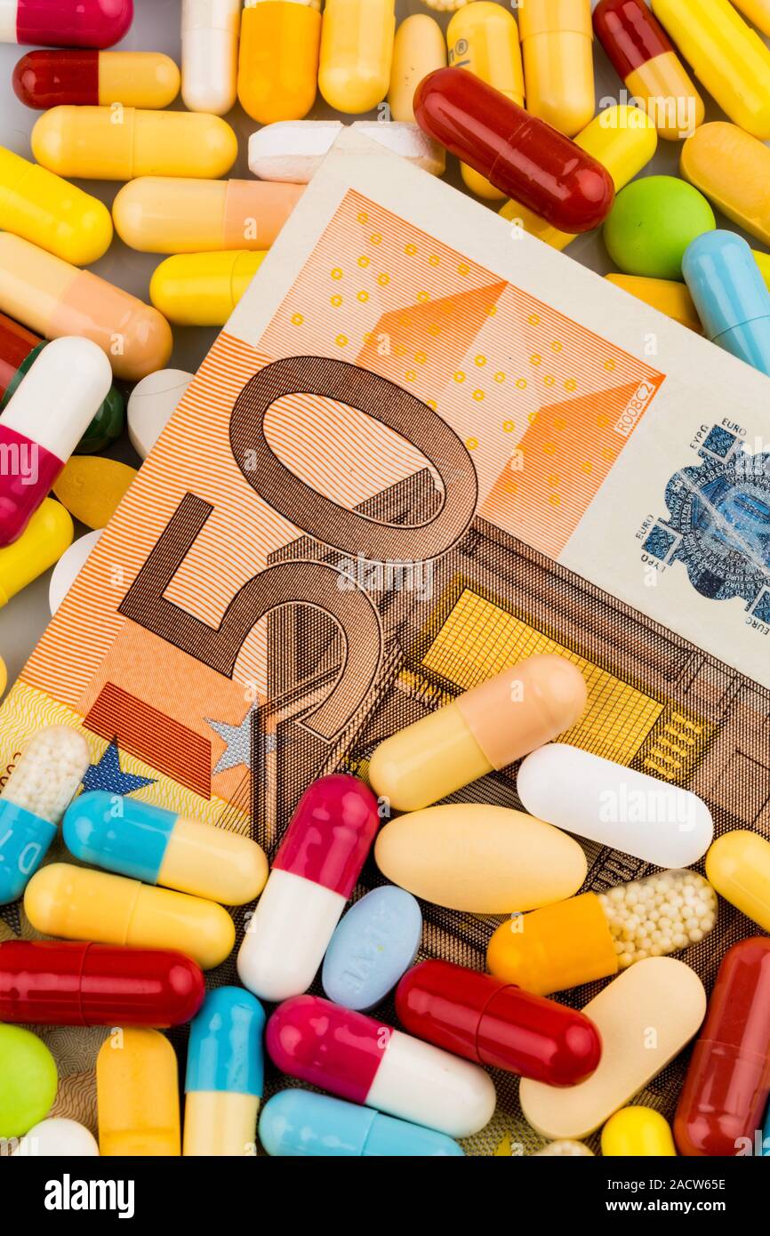 Euro banknotes and tablets Stock Photo - Alamy