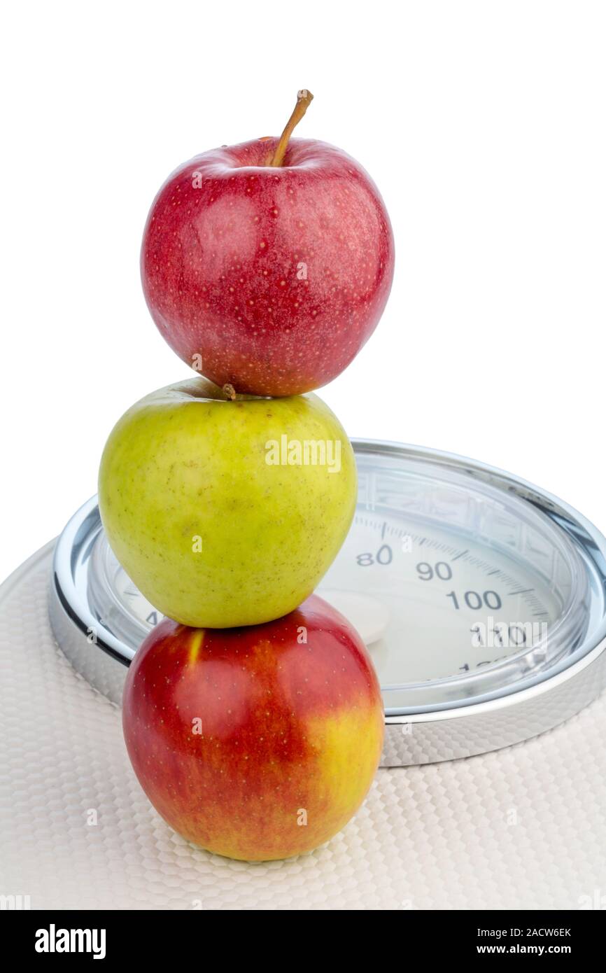 Apples on a scale Stock Photo - Alamy