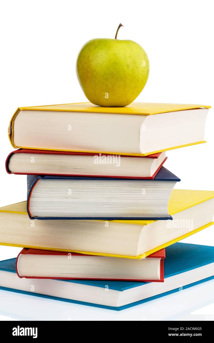 Apple on a stack of books Stock Photo - Alamy
