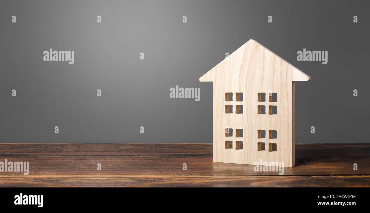 Wooden house figure. Affordable comfortable housing. Purchase of ...