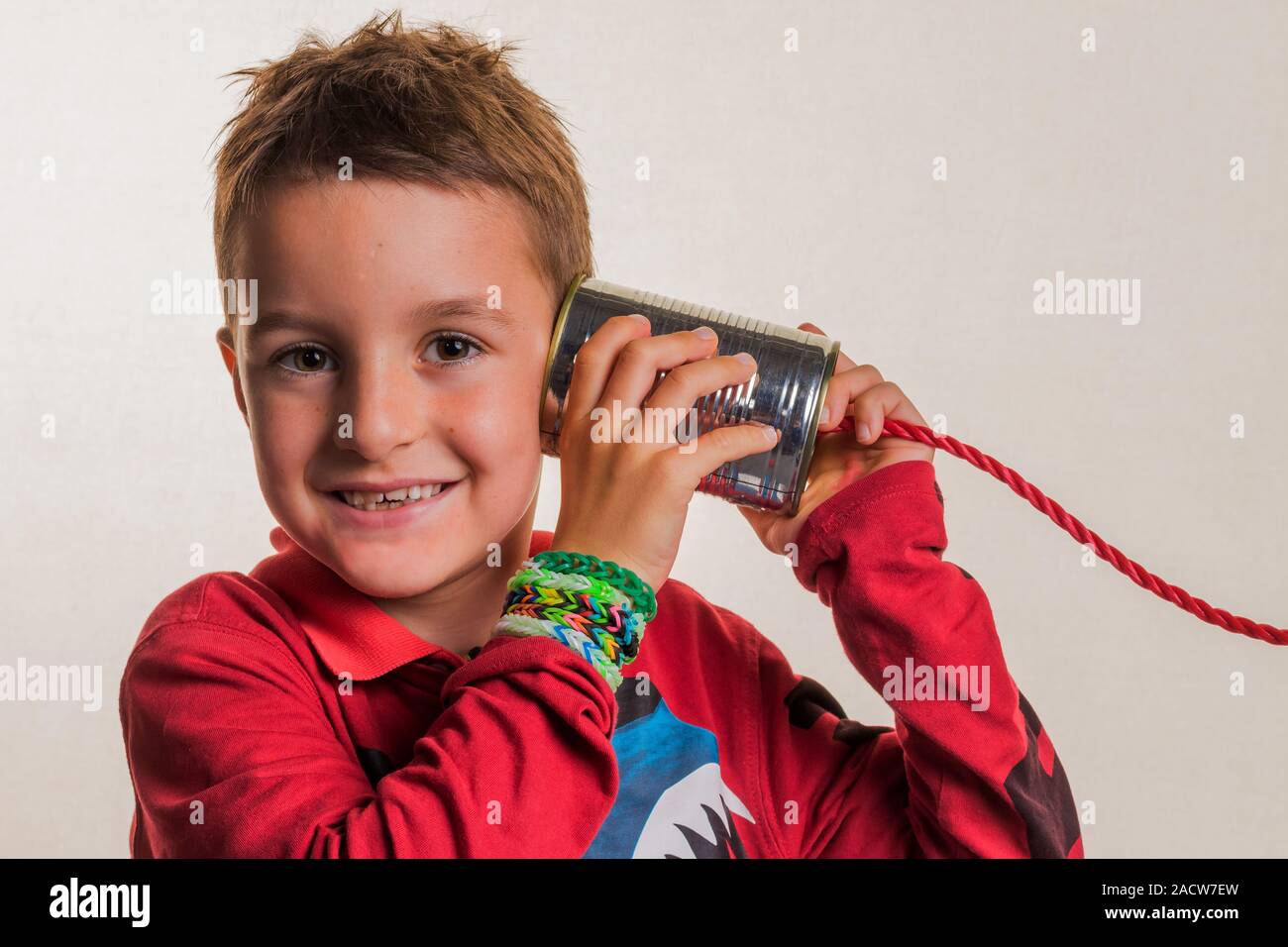 Child with a box telephone Stock Photo - Alamy