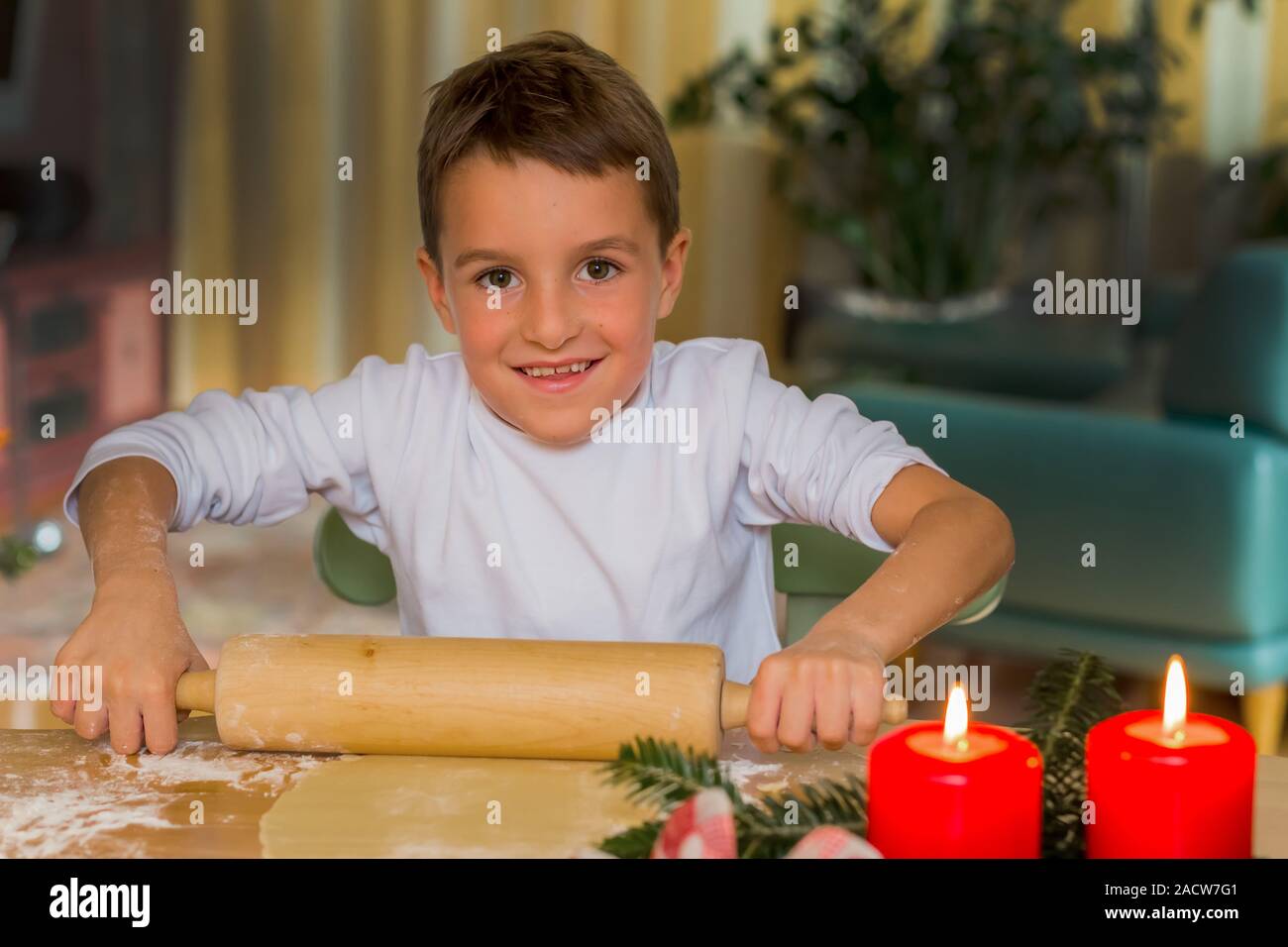Child baking biscuits for Christmas Stock Photo - Alamy