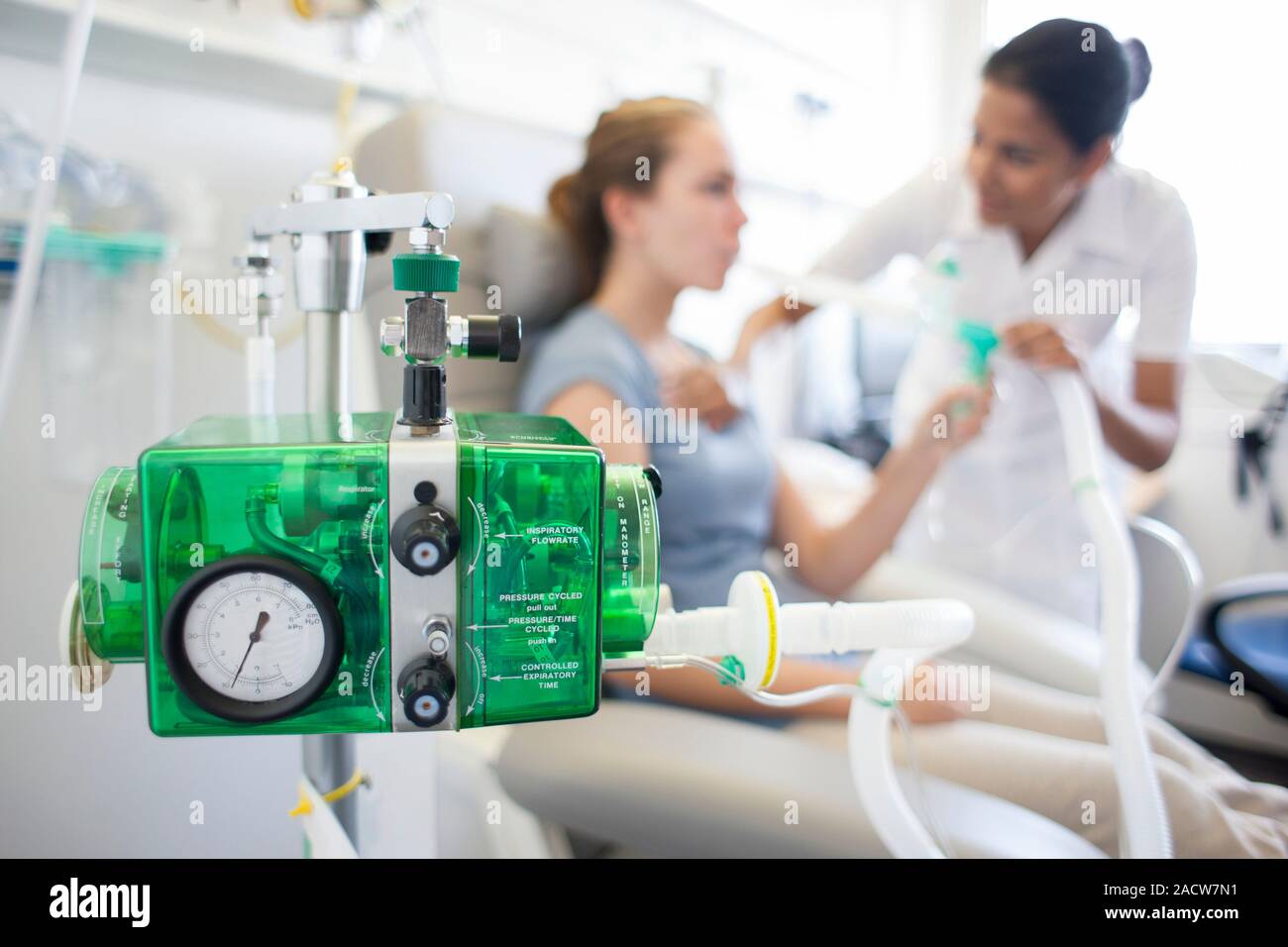 IPPB therapy for cystic fibrosis. Physiotherapist using an intermittent ...