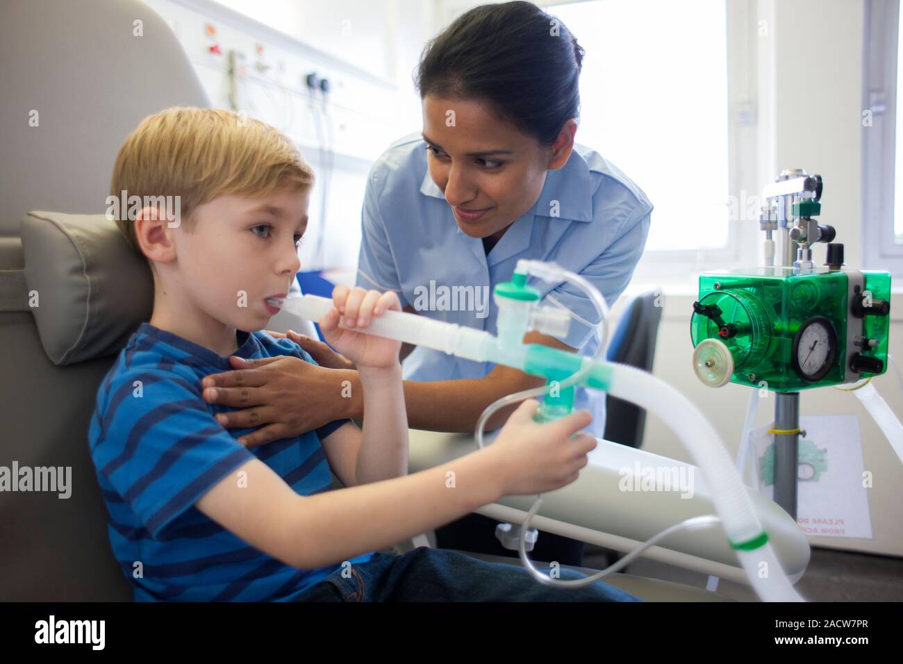 IPPB therapy for cystic fibrosis. Physiotherapist using an intermittent ...