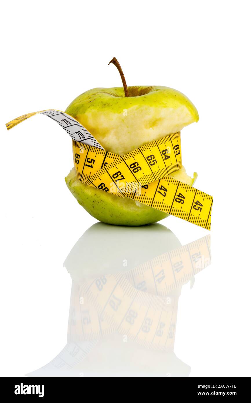Apple on with tape measure Stock Photo - Alamy