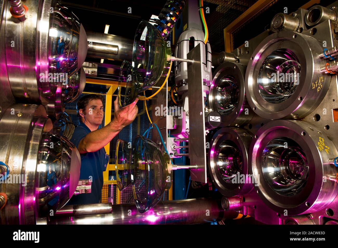 Tupperware factory. Worker in a factory that produces plastic ...